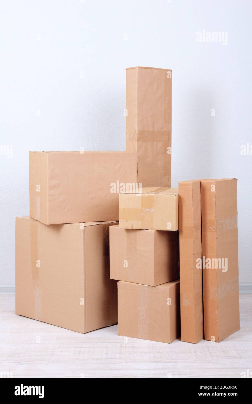 Different cardboard boxes in room Stock Photo - Alamy