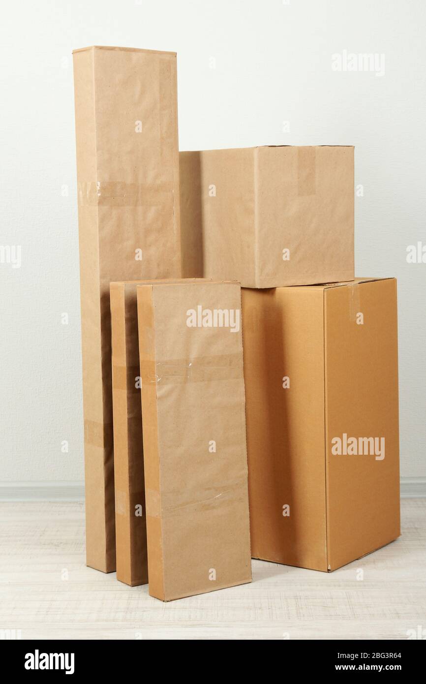 Different cardboard boxes in room Stock Photo - Alamy