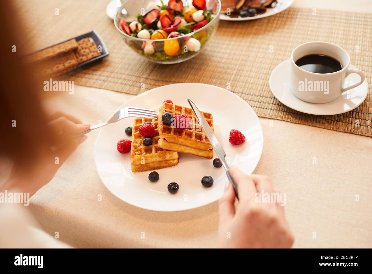 Woman eating food restaurant alone hi-res stock photography and images ...