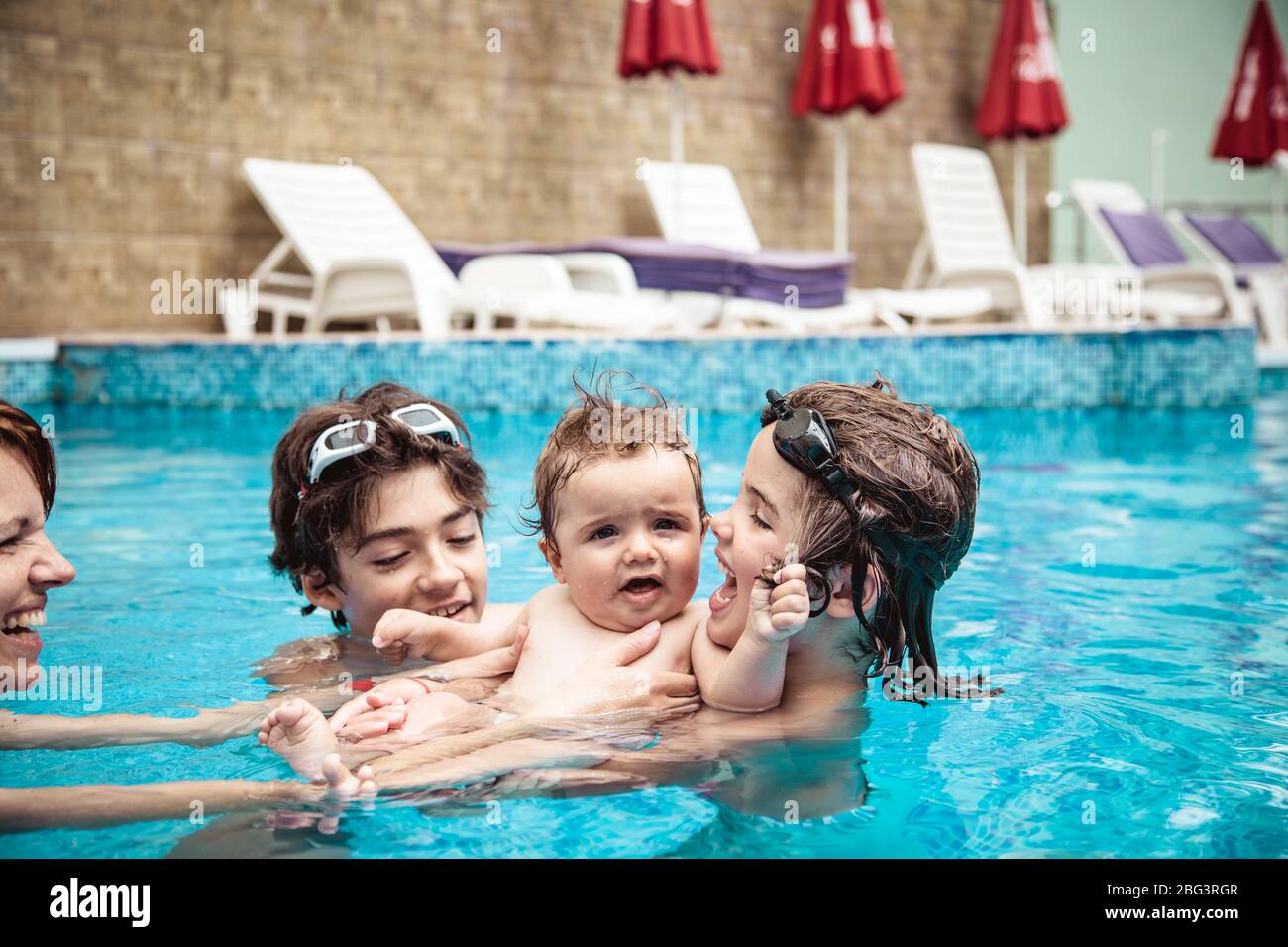 People messing about in swimming pool hi-res stock photography and ...