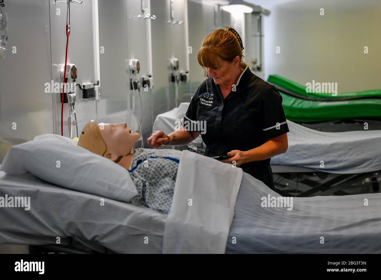 A simulation technician takes part in medical training inside a ward at ...