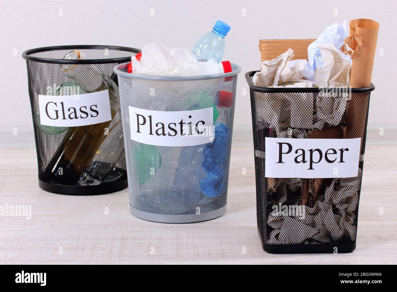 Three buckets of assorted debris on room background Stock Photo - Alamy