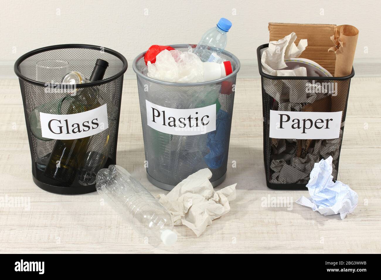 Three buckets of assorted debris on room background Stock Photo - Alamy