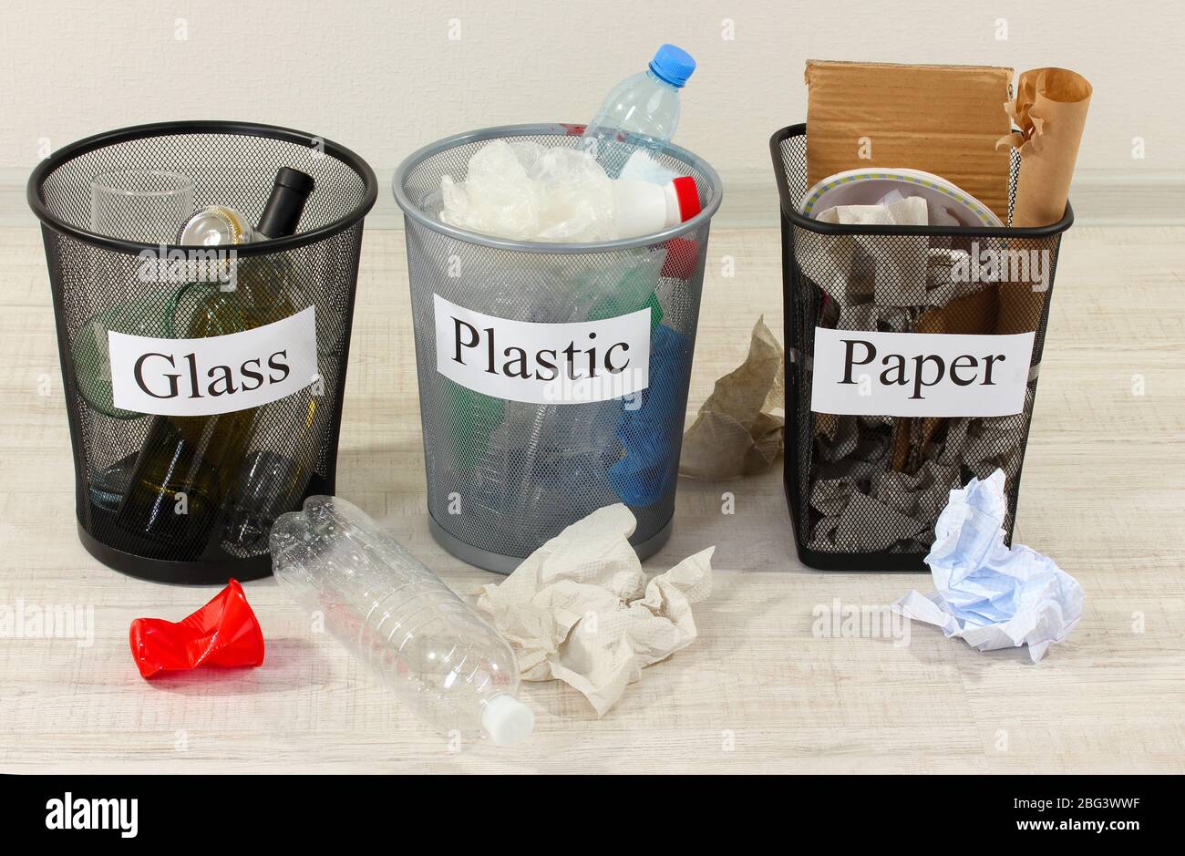 Three buckets of assorted debris on room background Stock Photo - Alamy