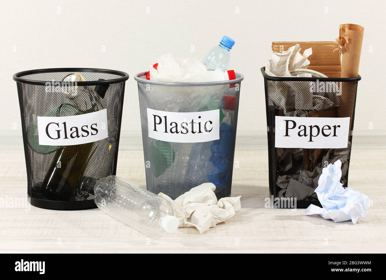 Three buckets of assorted debris on room background Stock Photo - Alamy