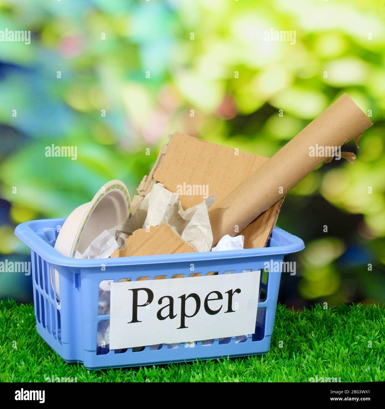 Assorted trash in baskets on nature background Stock Photo - Alamy