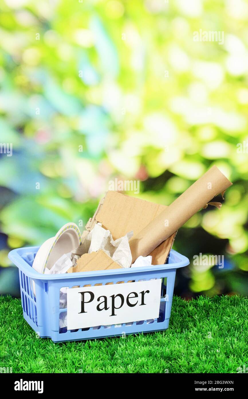 Assorted trash in baskets on nature background Stock Photo - Alamy