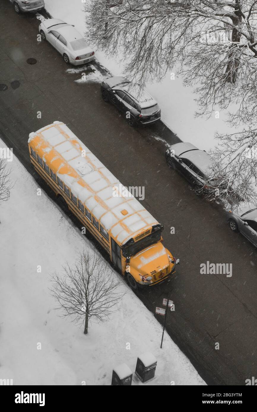 Overhead view of a school bus and cars in winter, Chicago, Illinois ...