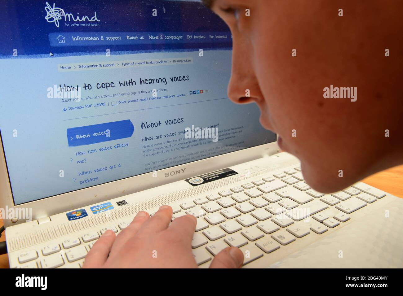A young man searches the mind.org.uk website to find information on ...