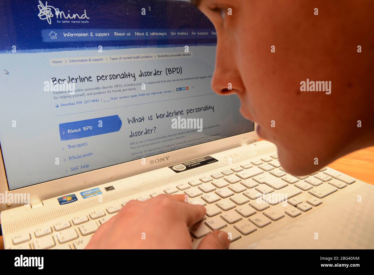 A young man searches the mind.org.uk website to find information on ...