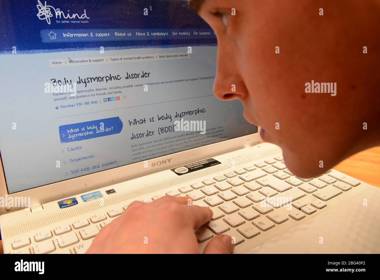 A young man searches the mind.org.uk website to find information on ...