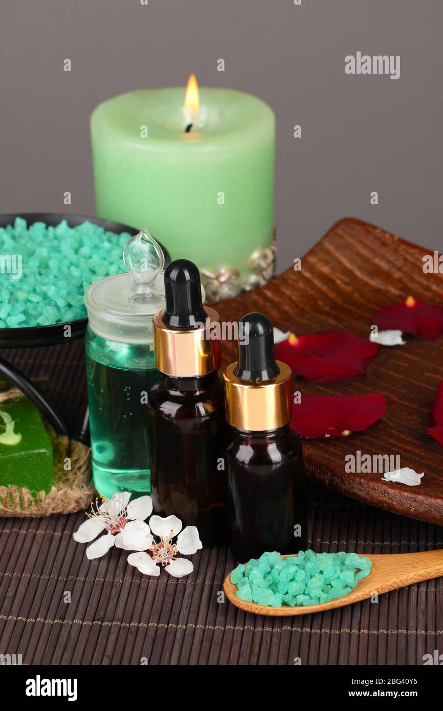 Spa composition with aroma oils on table on gray background Stock Photo ...