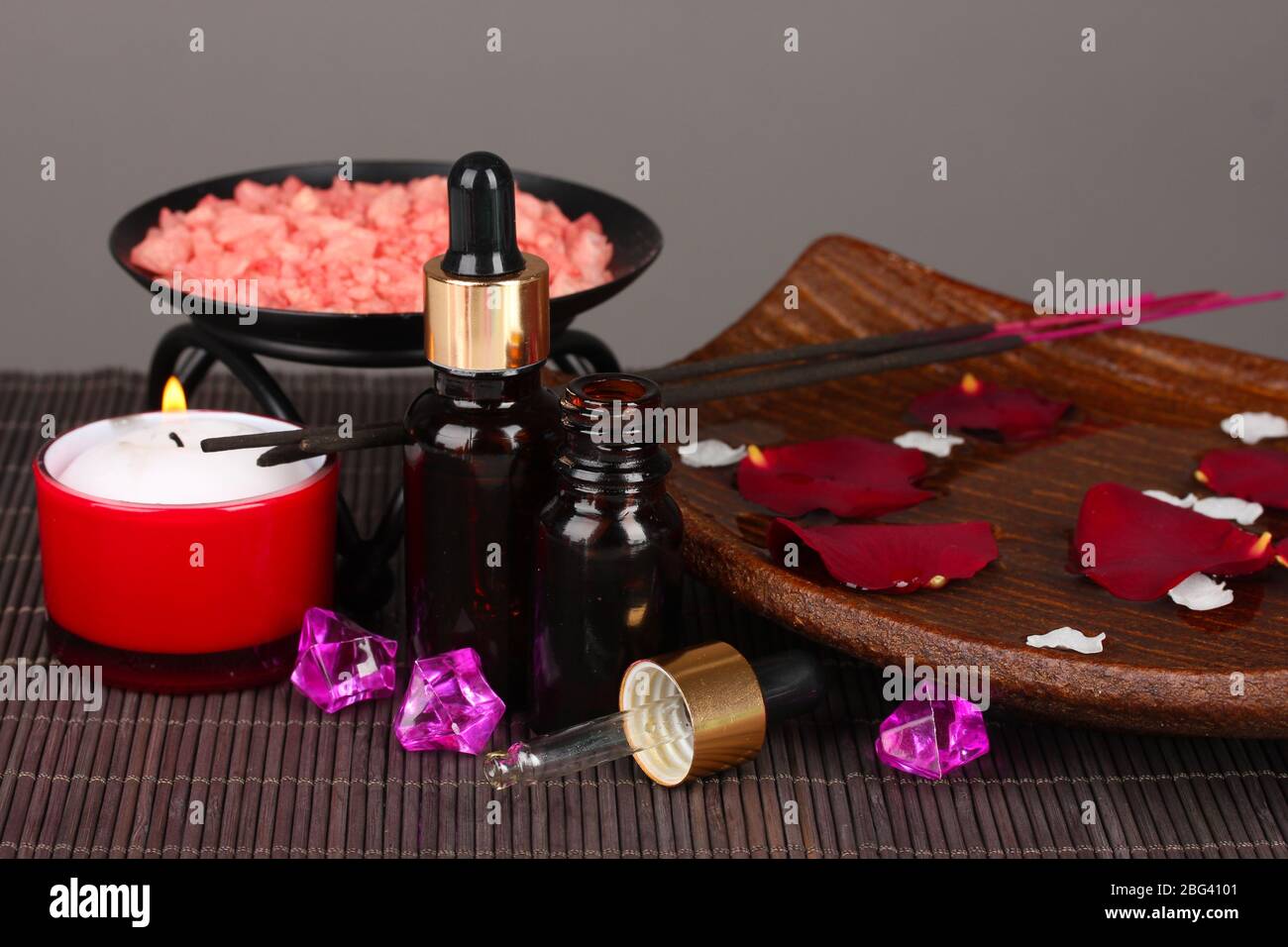 Spa composition with aroma oils on table on gray background Stock Photo ...