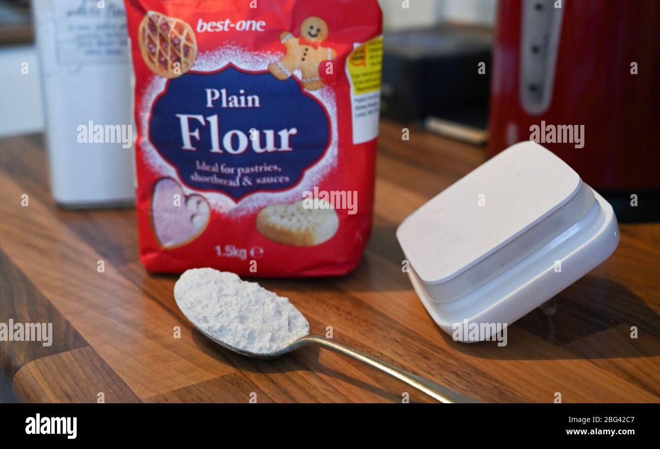 A bag and spoonful of best-one supermarket white plain flour which has ...