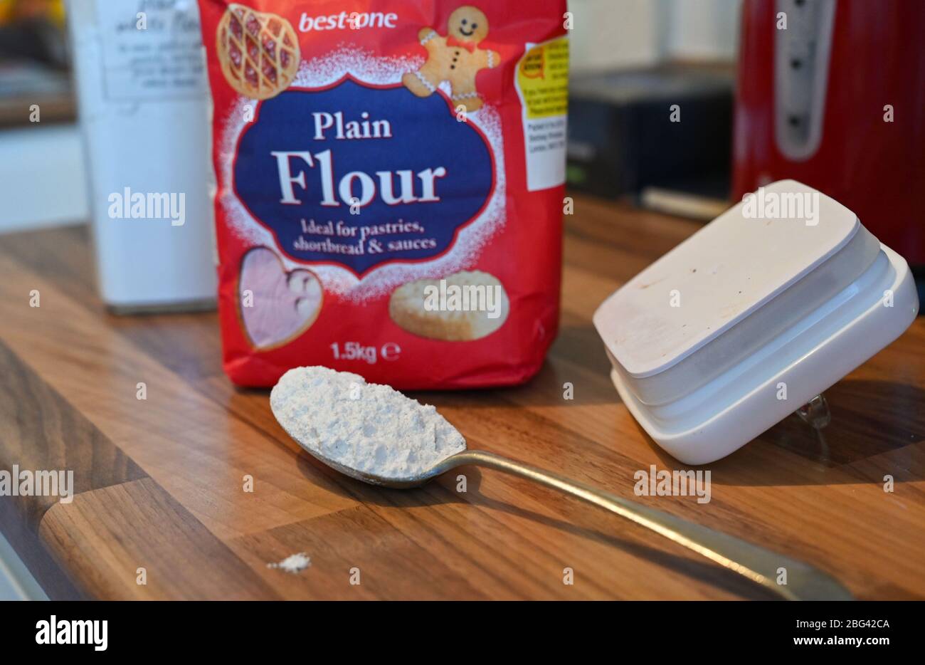 A bag and spoonful of best-one supermarket white plain flour which has ...
