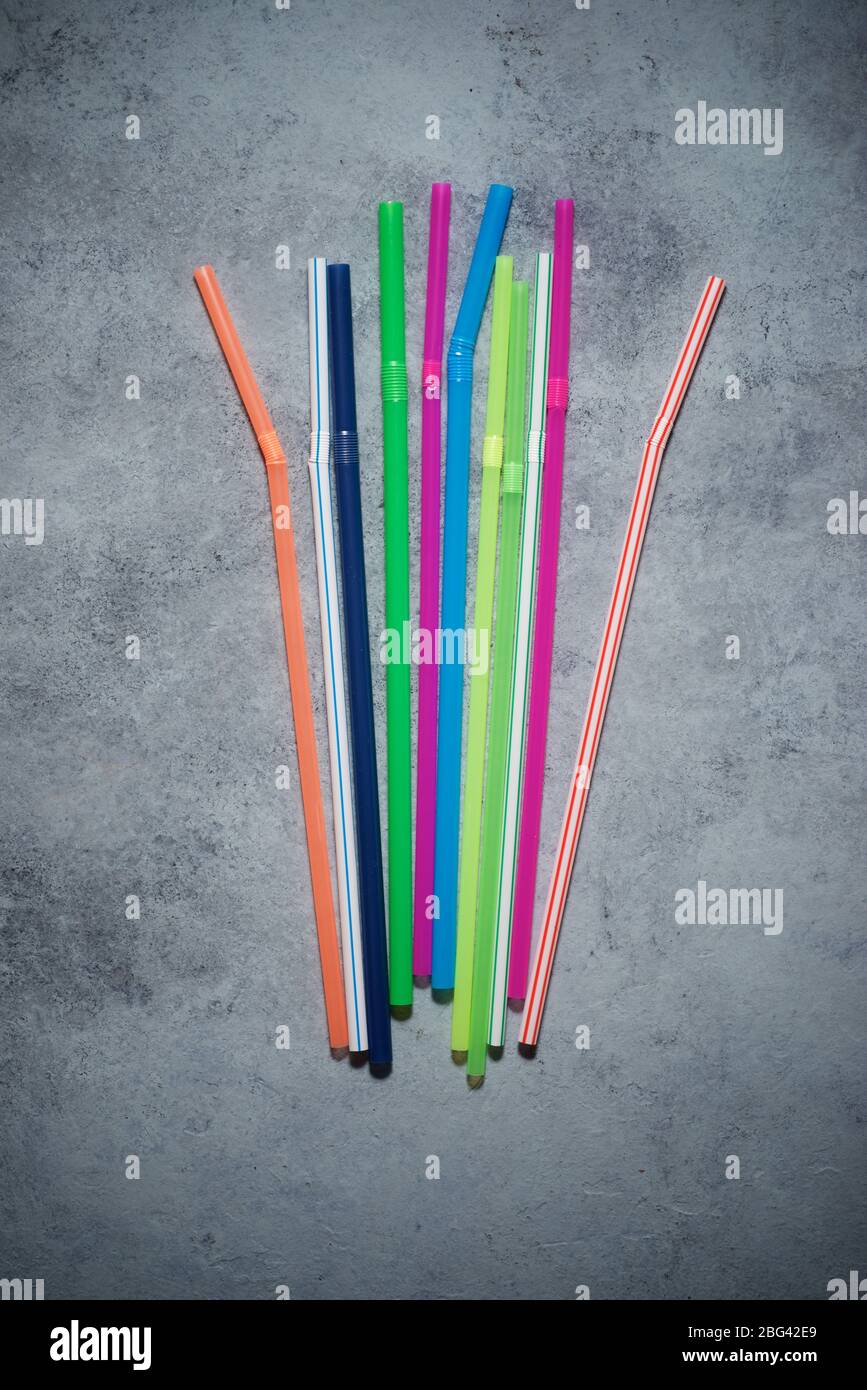 Drinking plastic straws on a stone table Stock Photo - Alamy