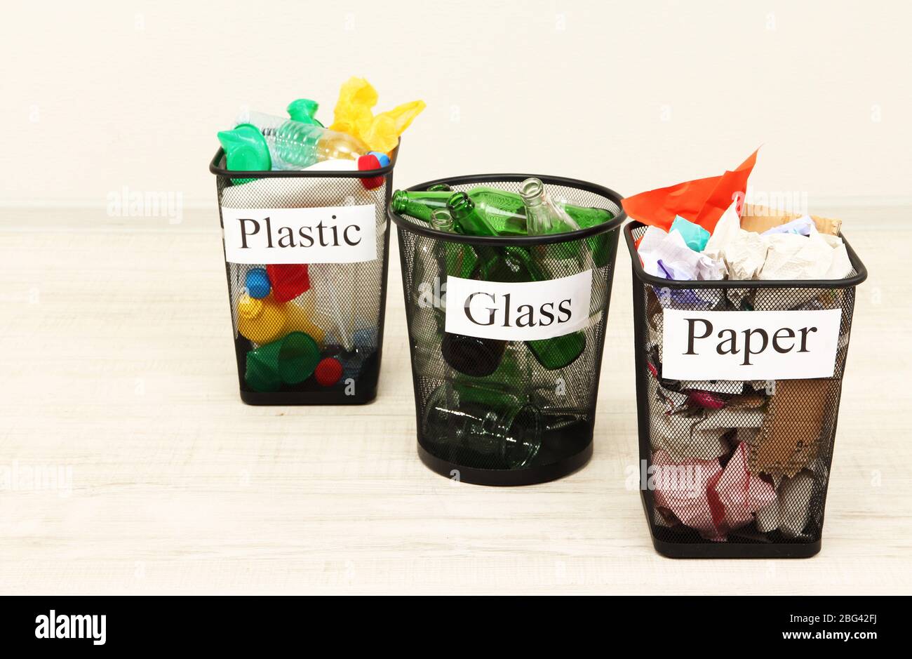 Buckets for waste sorting on room background Stock Photo - Alamy