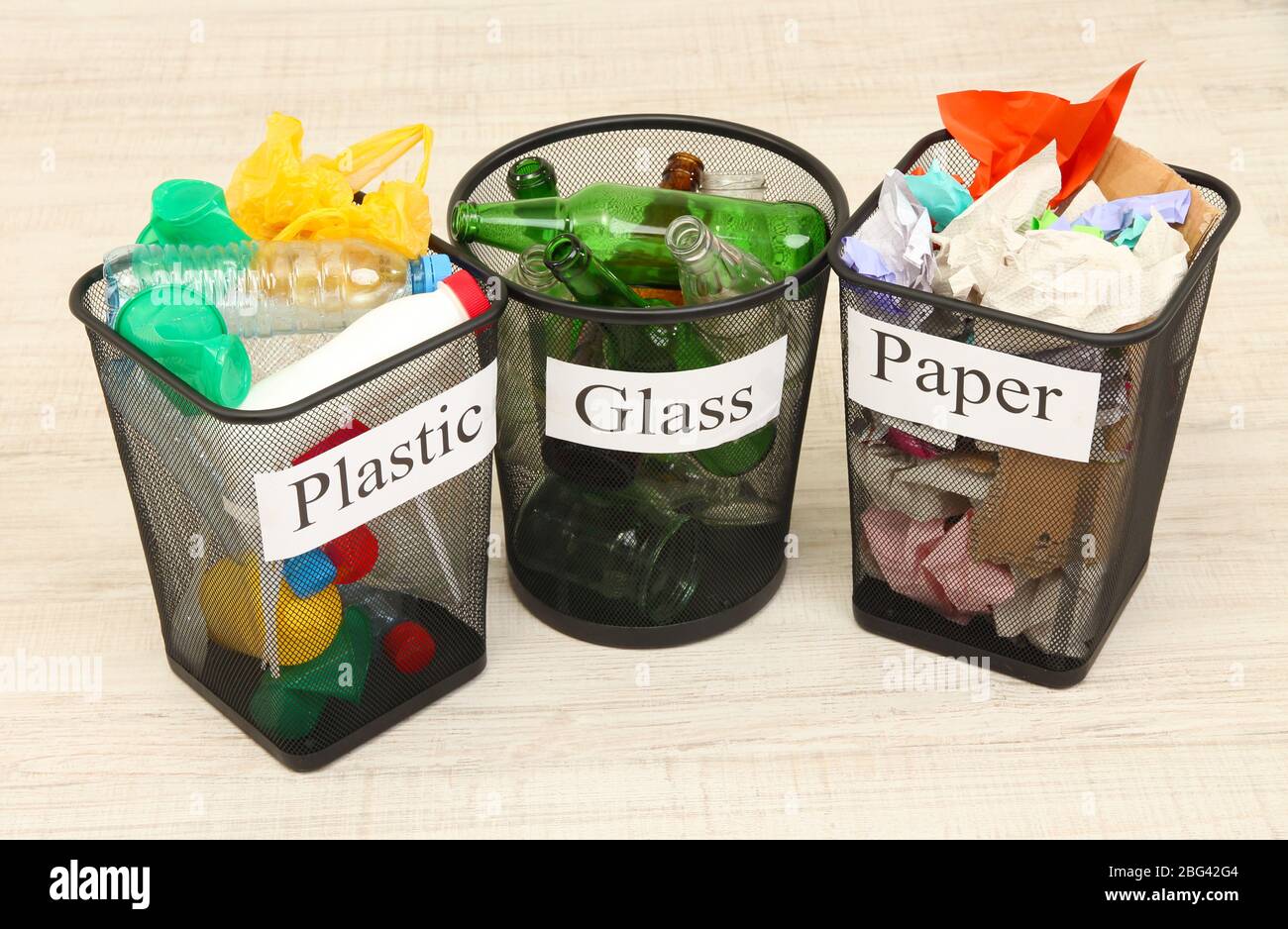 Buckets for waste sorting on room background Stock Photo - Alamy