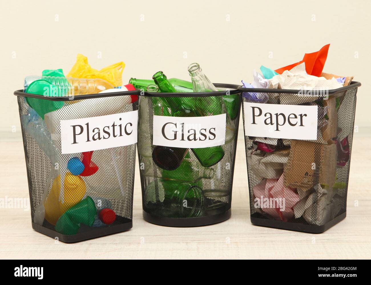 Buckets for waste sorting on room background Stock Photo - Alamy