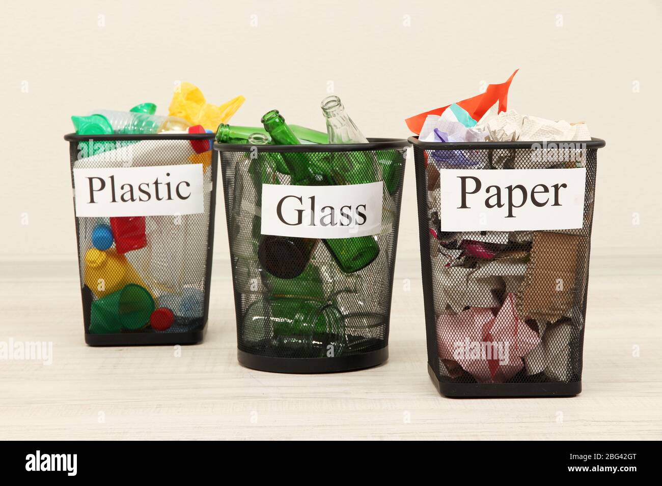 Buckets for waste sorting on room background Stock Photo - Alamy