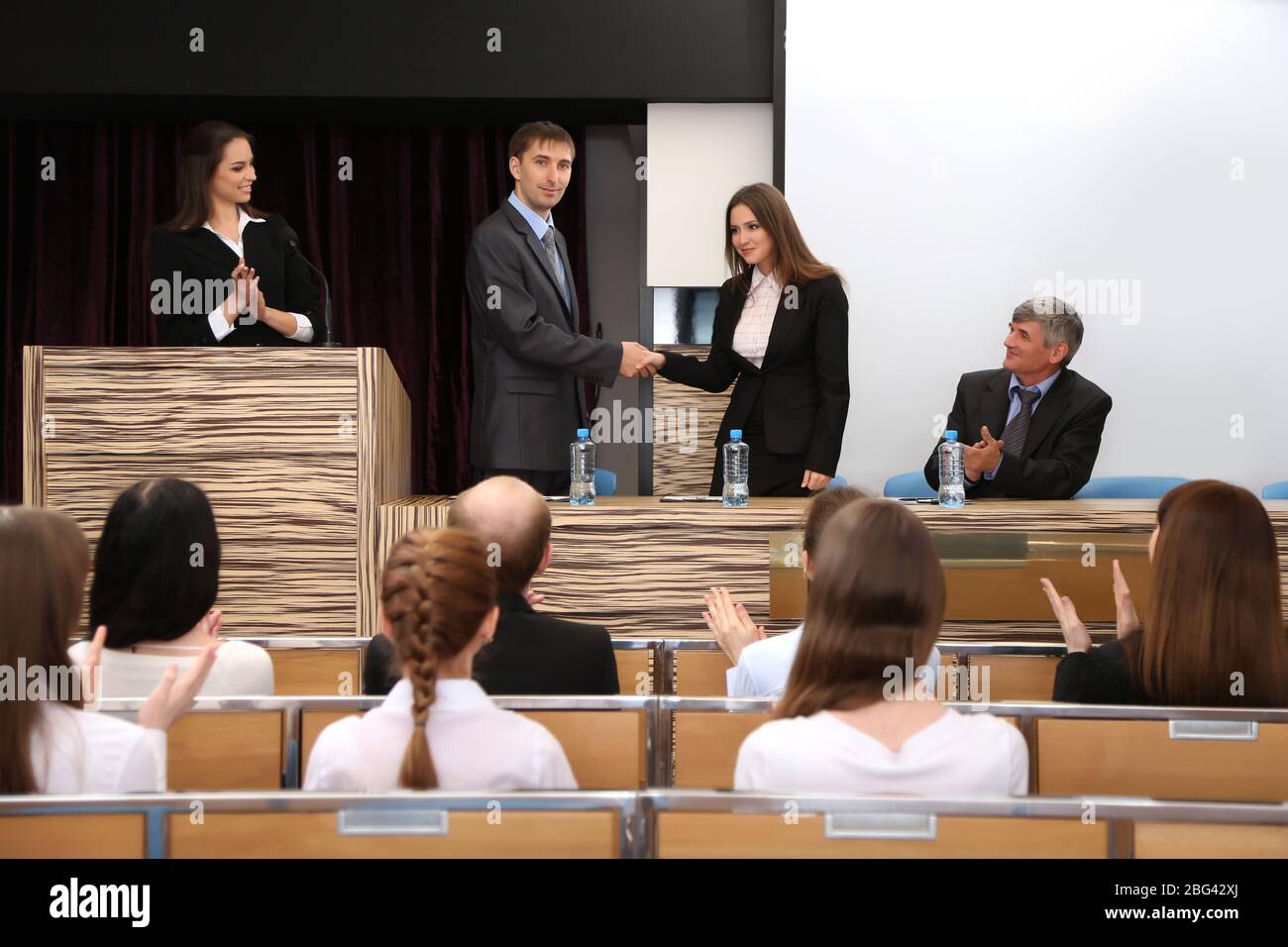 Business people at tribune in conference room Stock Photo - Alamy
