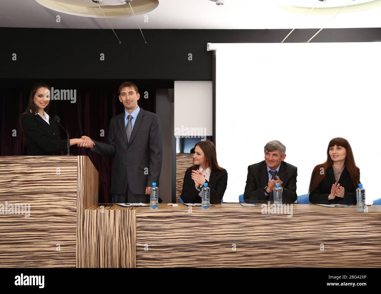Business people at tribune in conference room Stock Photo - Alamy
