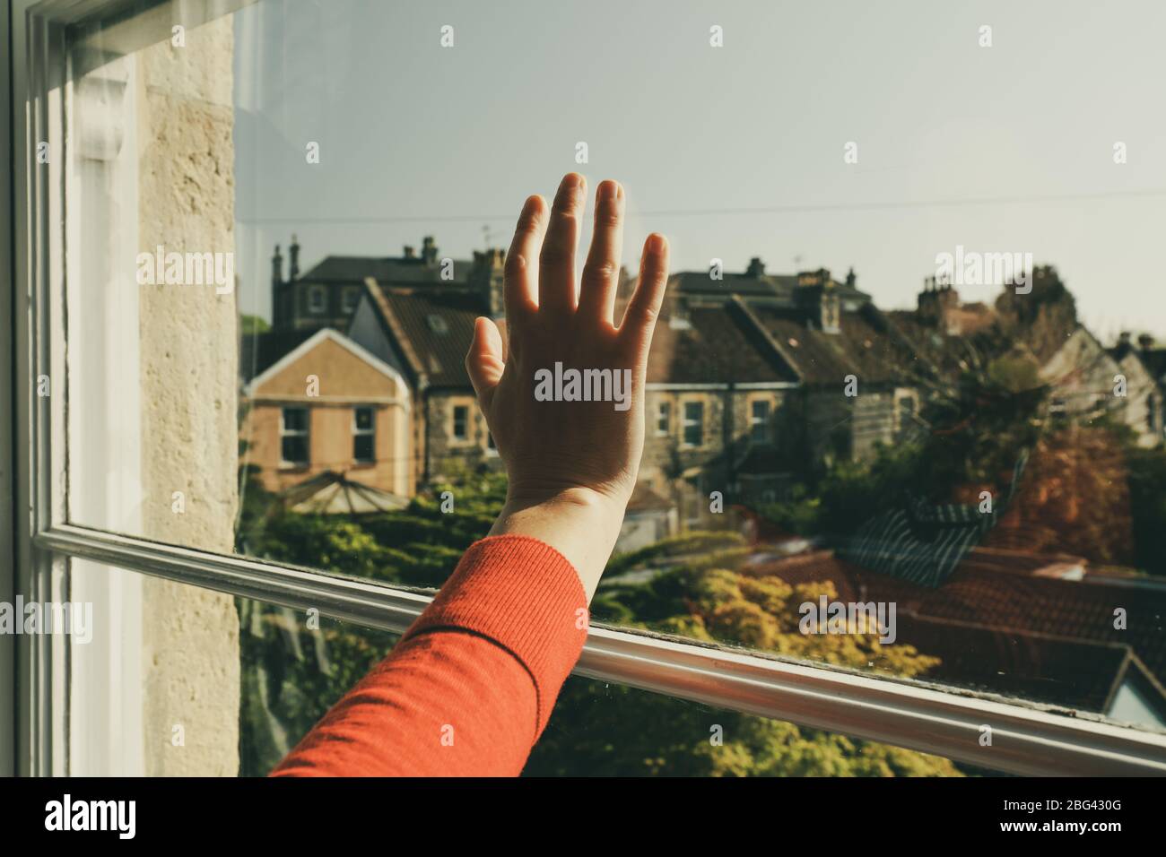 Woman leaning against glass window hi-res stock photography and images ...