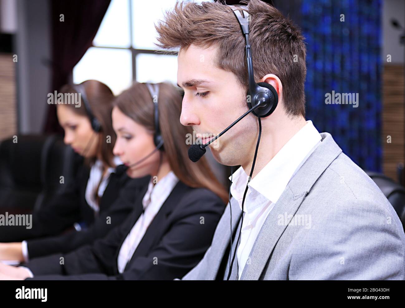 Call center operators at work Stock Photo - Alamy