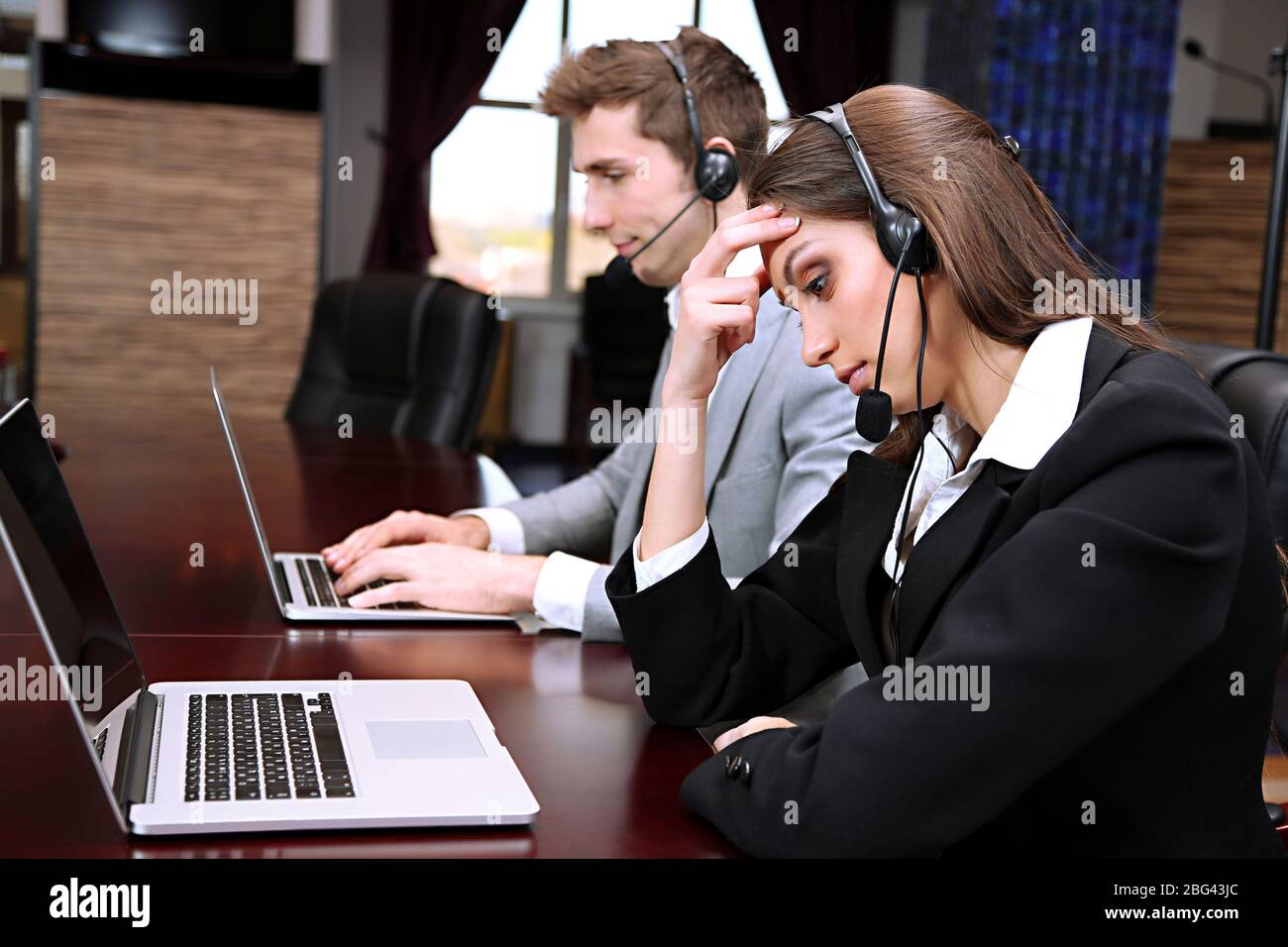 Call center operators at work Stock Photo - Alamy