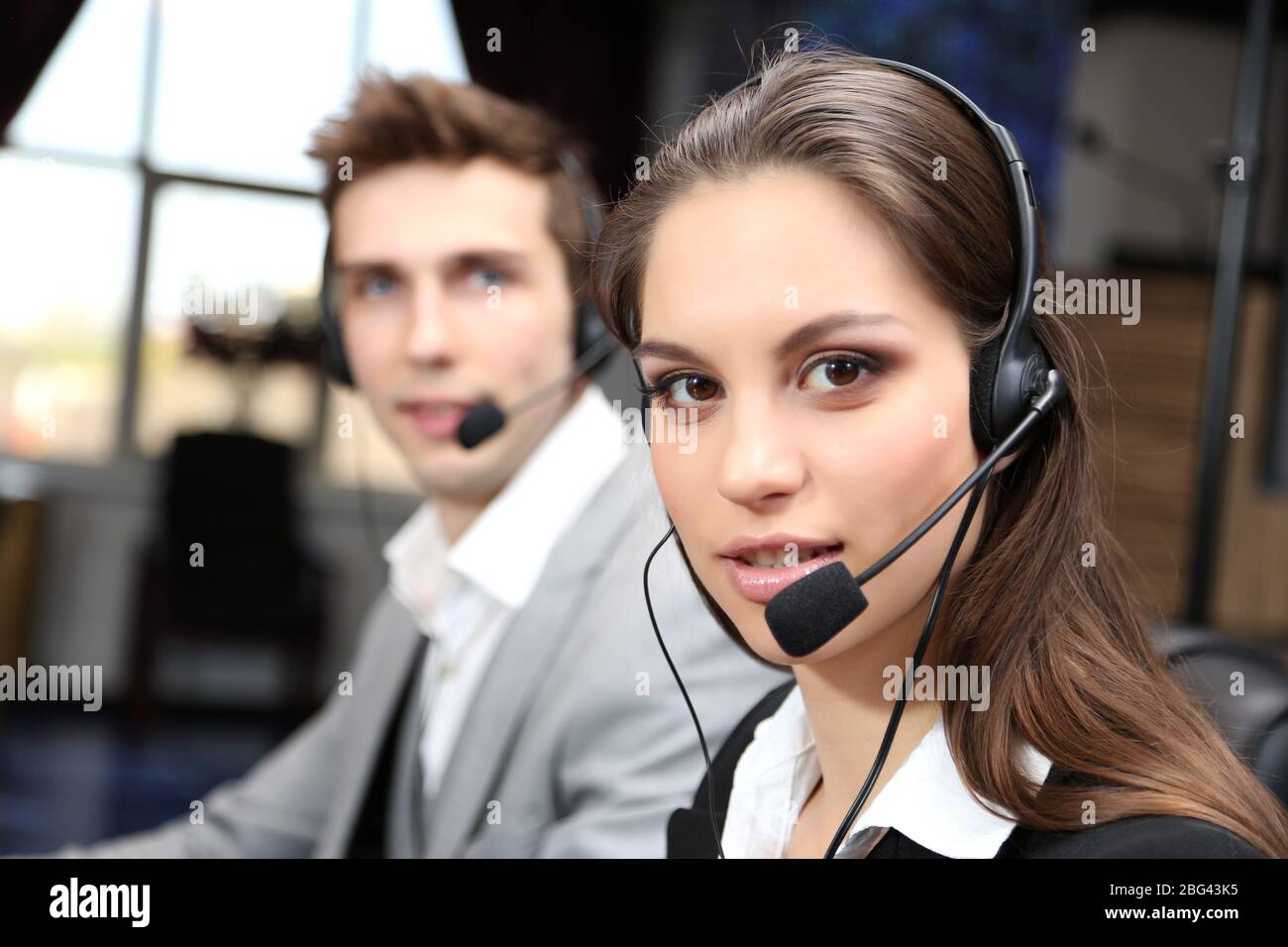 Call center operators at work Stock Photo - Alamy