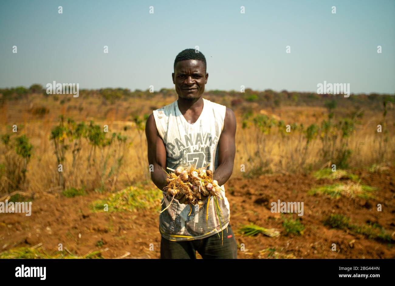 Huambo, Angola - August 27th 2019: Young local farmer standing on a ...