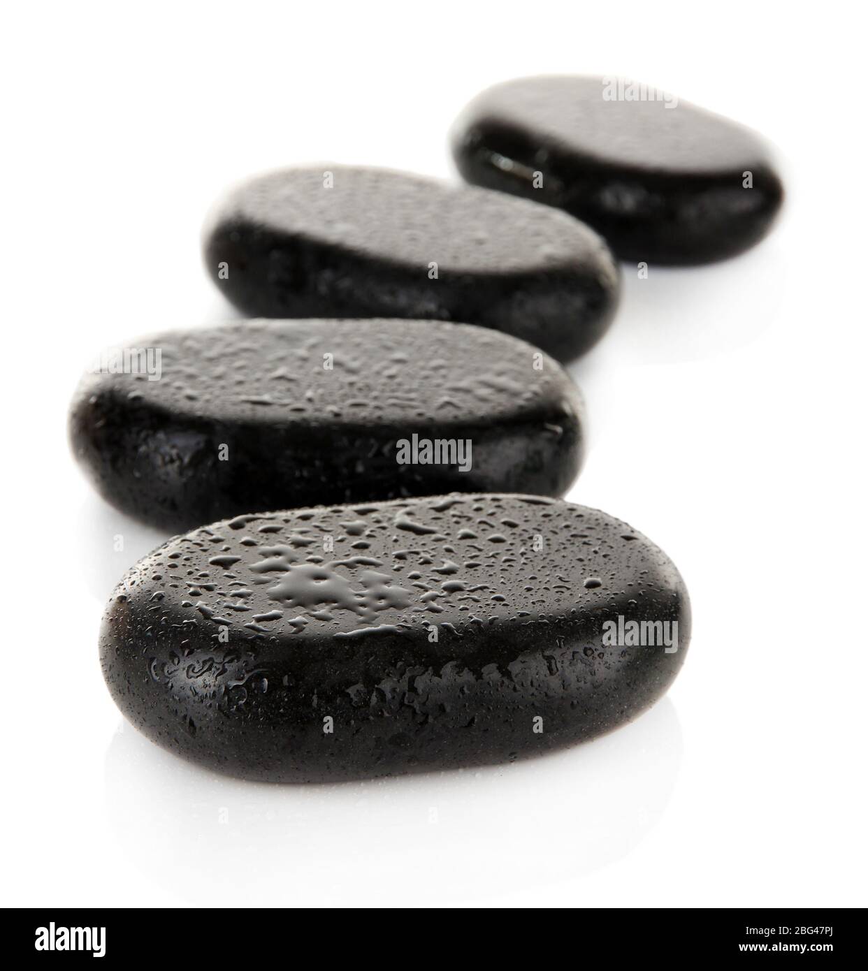 Spa stones isolated on white Stock Photo - Alamy