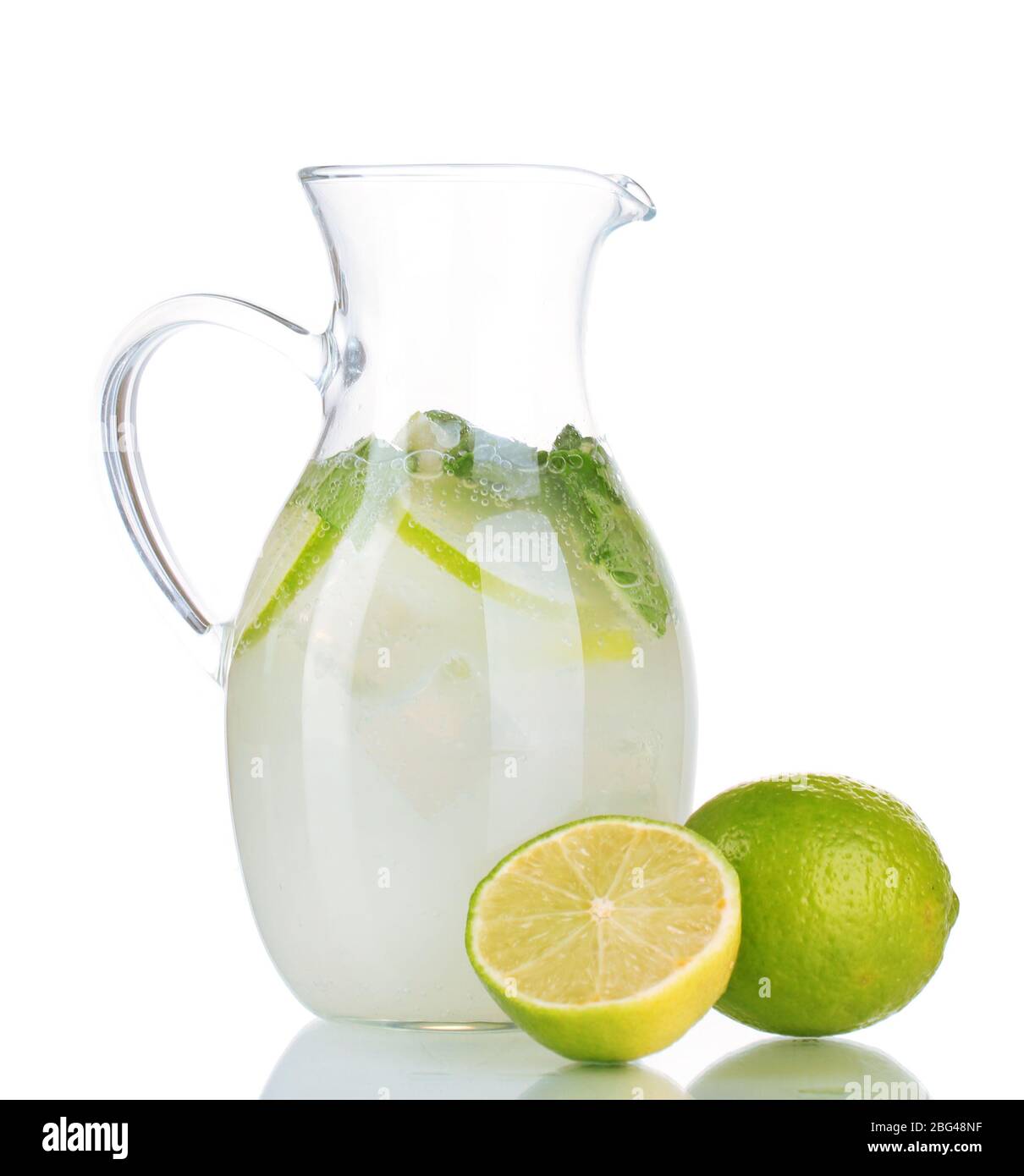 Lemonade in pitcher isolated on white Stock Photo - Alamy