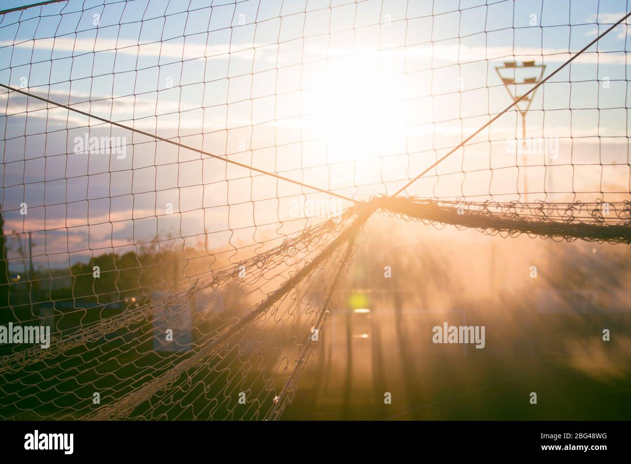 Sunset behind a football net in a field, Spain Stock Photo - Alamy