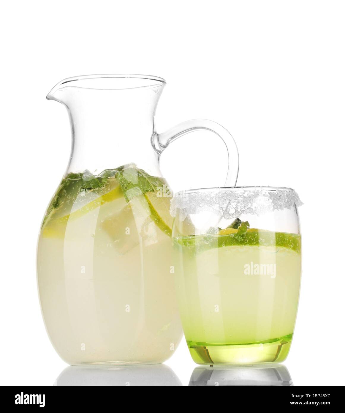 Lemonade in pitcher and glass isolated on white Stock Photo - Alamy