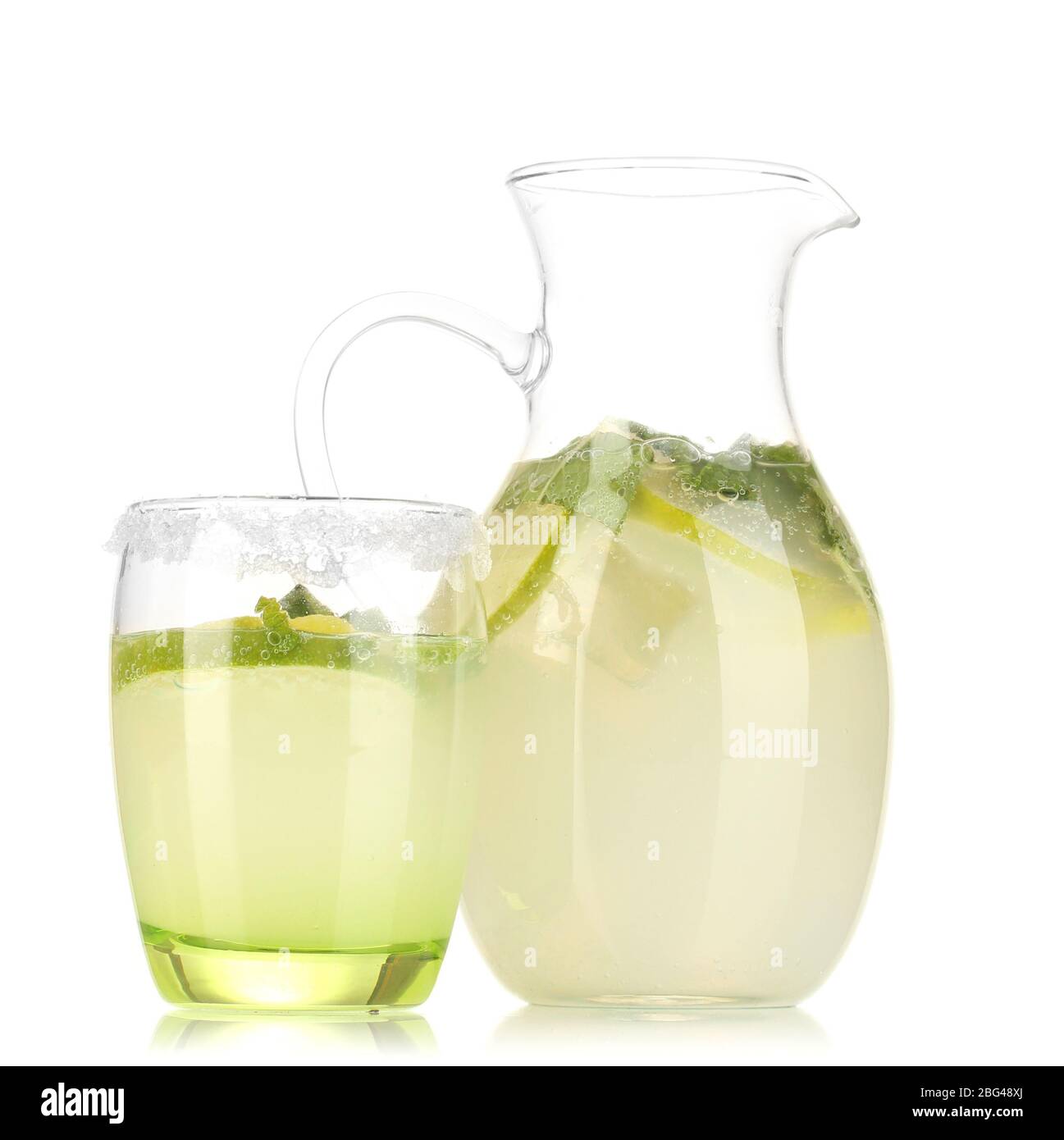 Lemonade in pitcher and glass isolated on white Stock Photo - Alamy
