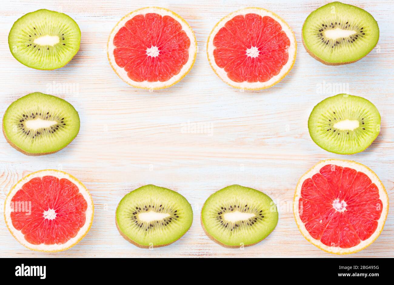 Minimal fruit background. Top view of sliced citrus fruits grapefruit ...