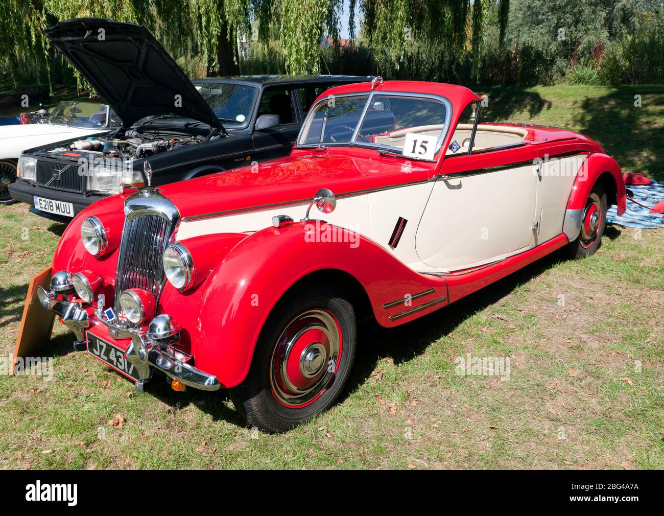 Three-Quarters Front view of a Red and Cream, Two-Door, 1950, Riley RMB ...