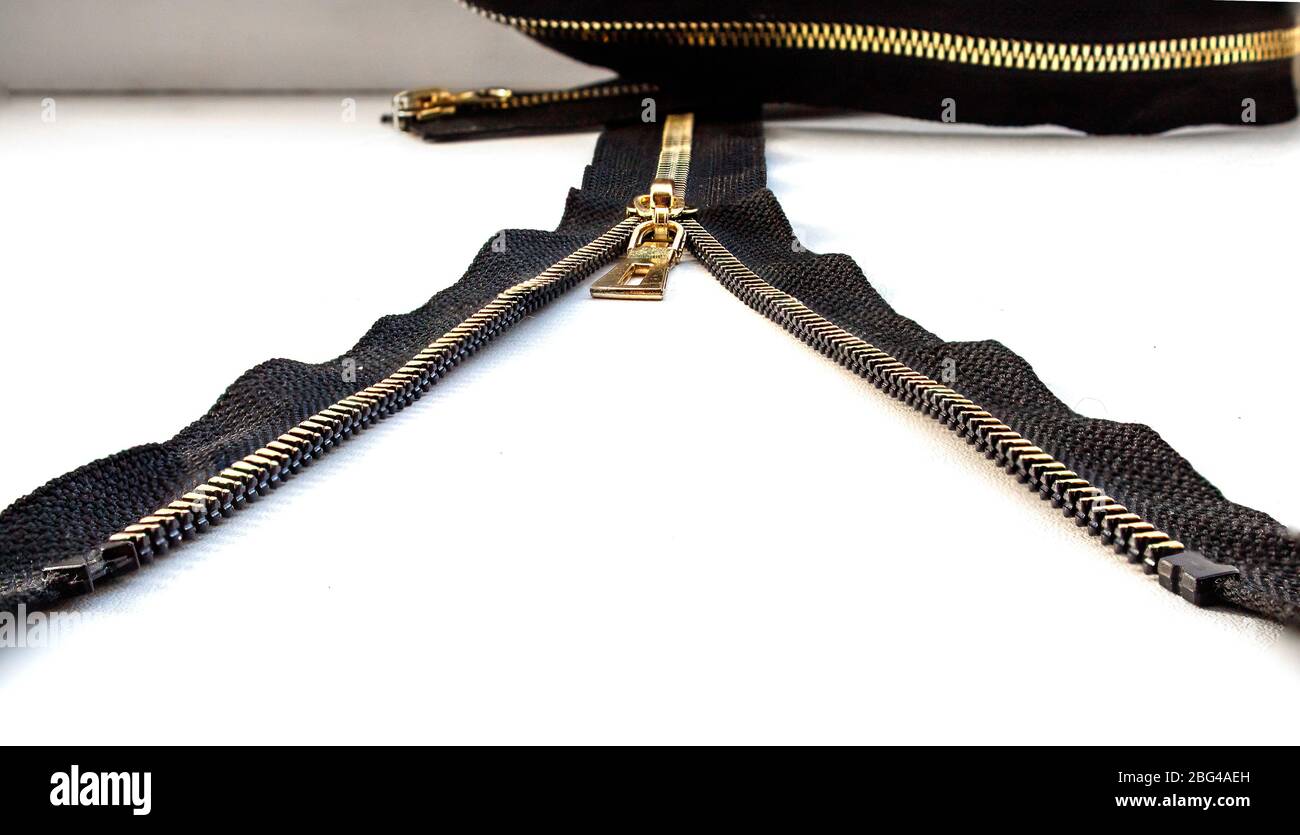 single metal opened zipper closeup on white background Stock Photo - Alamy