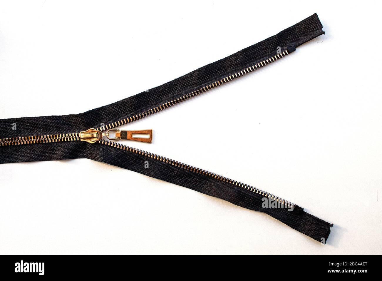 single metal opened zipper closeup on white background Stock Photo - Alamy