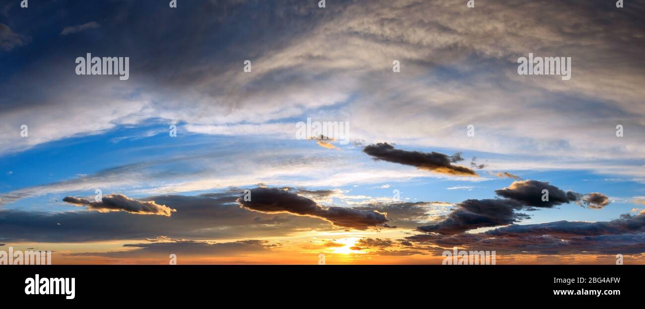 Summer sunset sky panorama with fleese clouds. Summer evening good ...