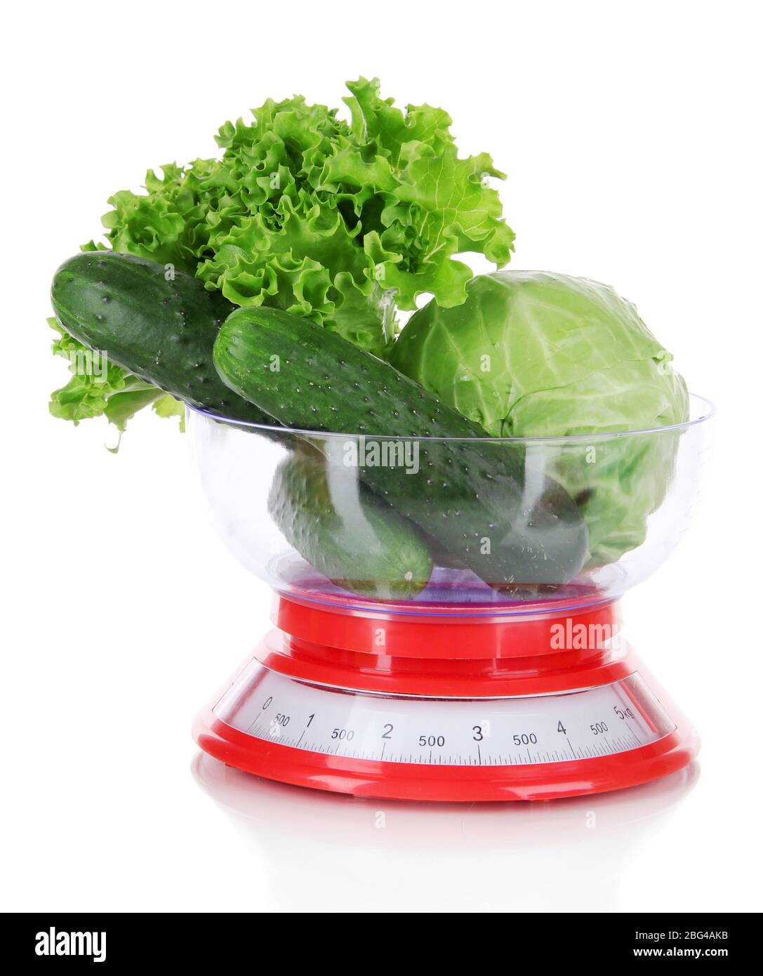 Fresh vegetables in scales isolated on white Stock Photo - Alamy