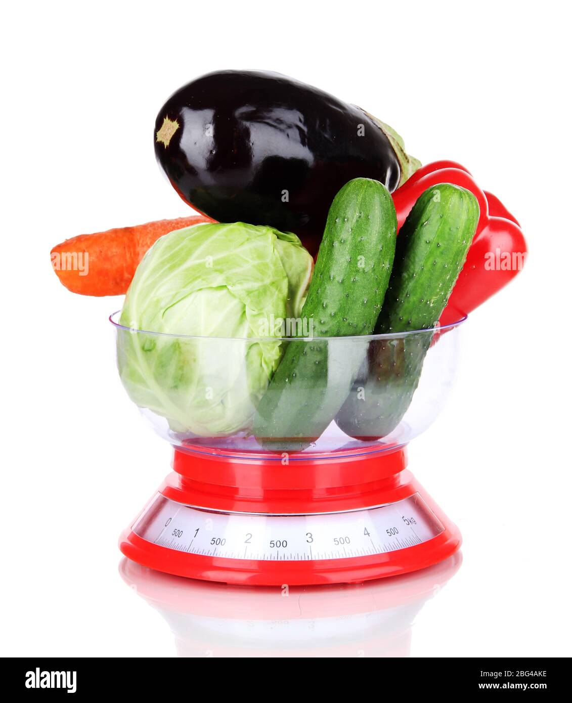 Fresh vegetables in scales isolated on white Stock Photo - Alamy