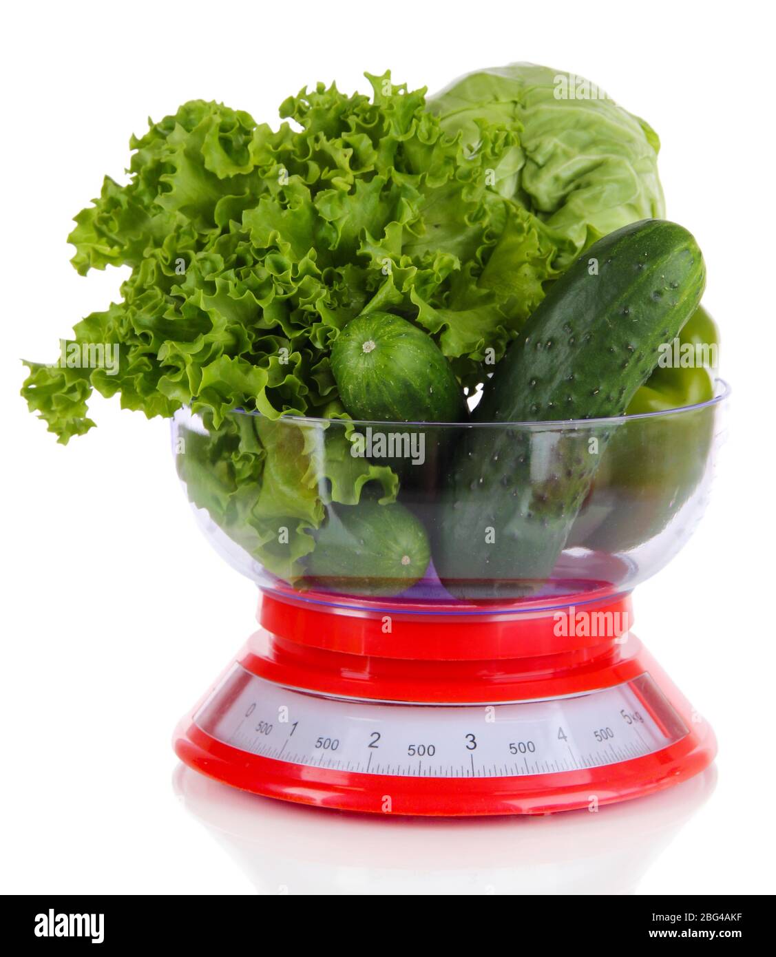 Fresh vegetables in scales isolated on white Stock Photo - Alamy