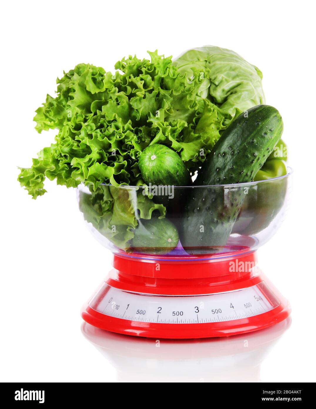 Fresh vegetables in scales isolated on white Stock Photo - Alamy