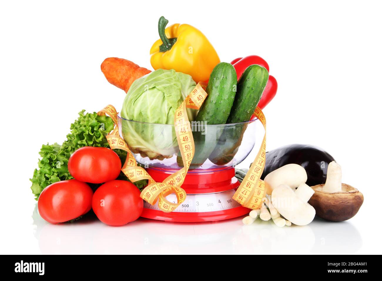 Fresh vegetables in scales isolated on white Stock Photo - Alamy