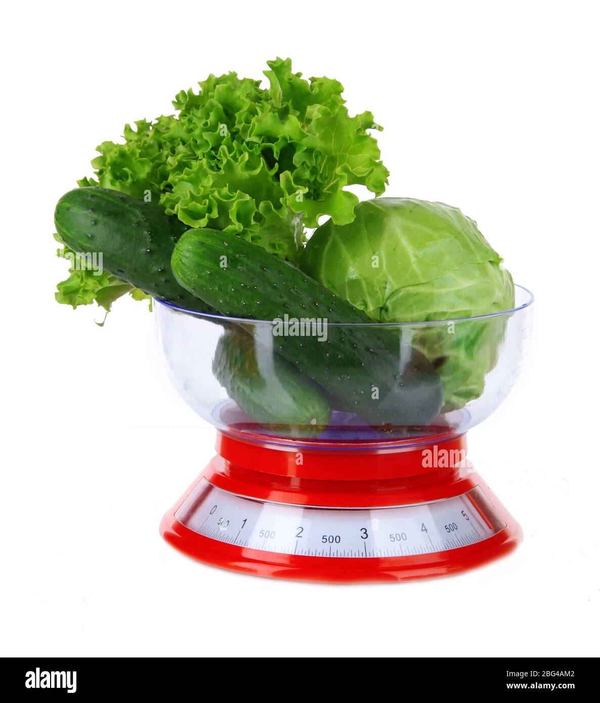 Fresh vegetables in scales isolated on white Stock Photo - Alamy