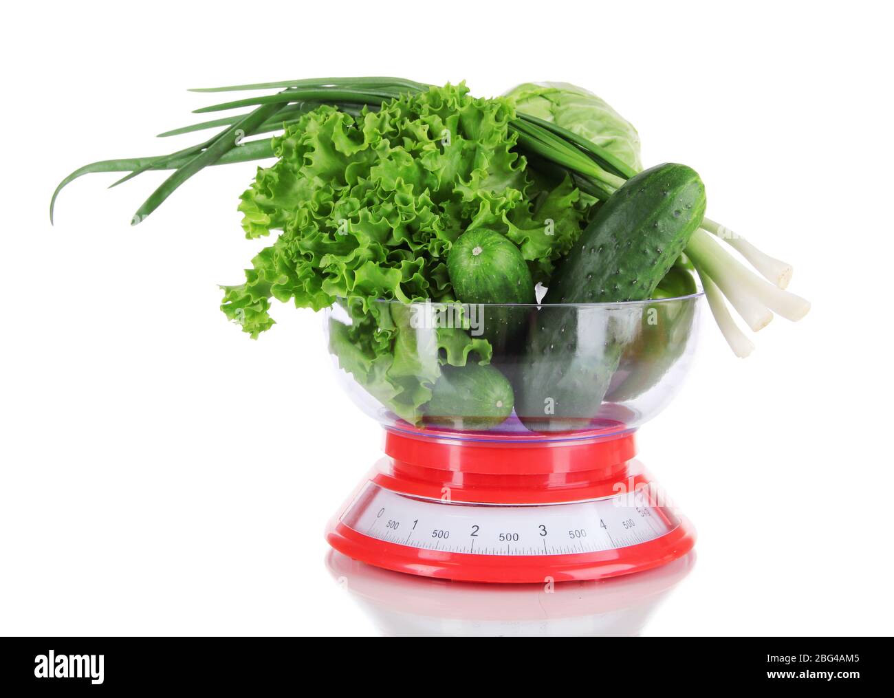 Fresh vegetables in scales isolated on white Stock Photo - Alamy
