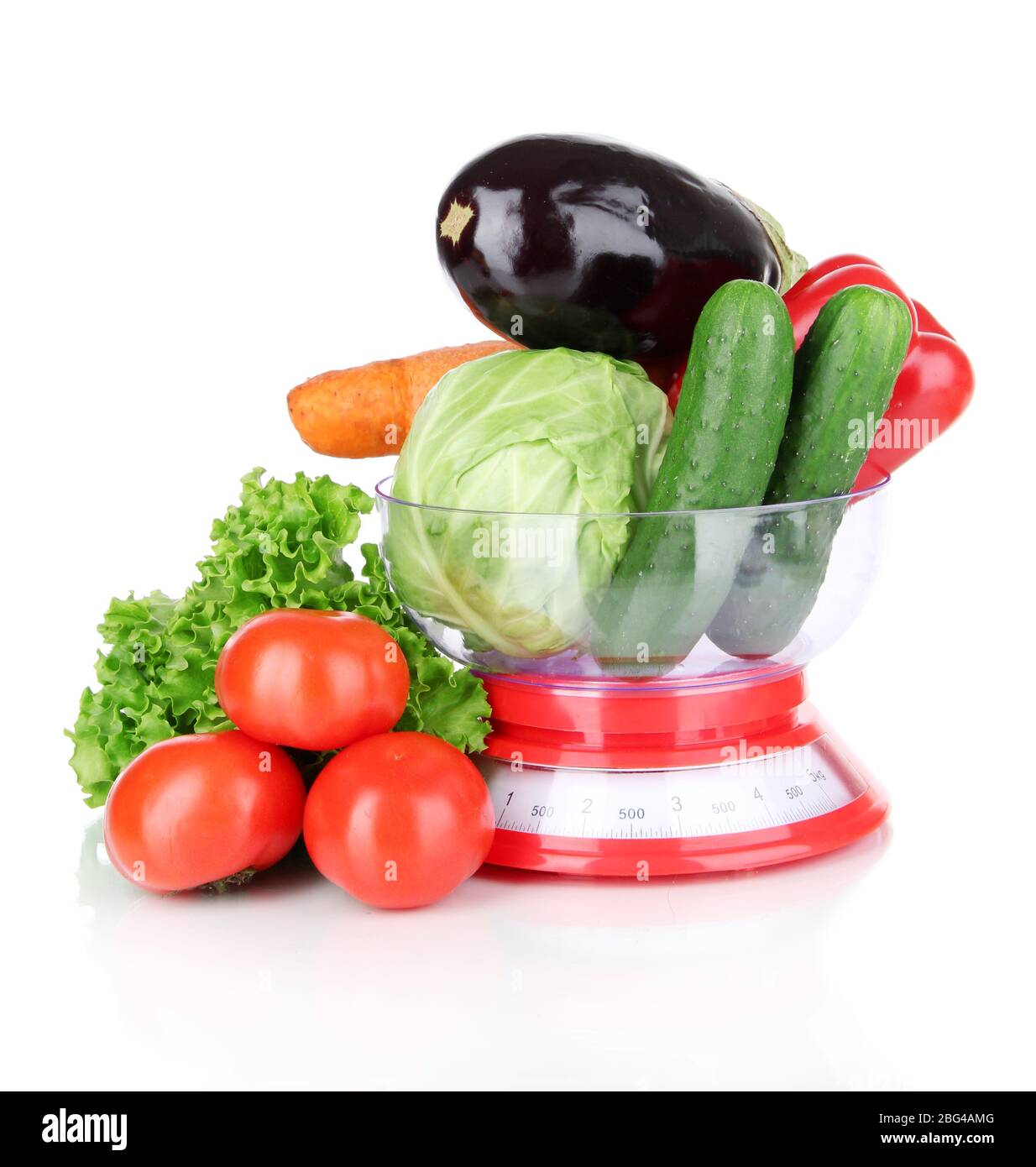 Fresh vegetables in scales isolated on white Stock Photo - Alamy