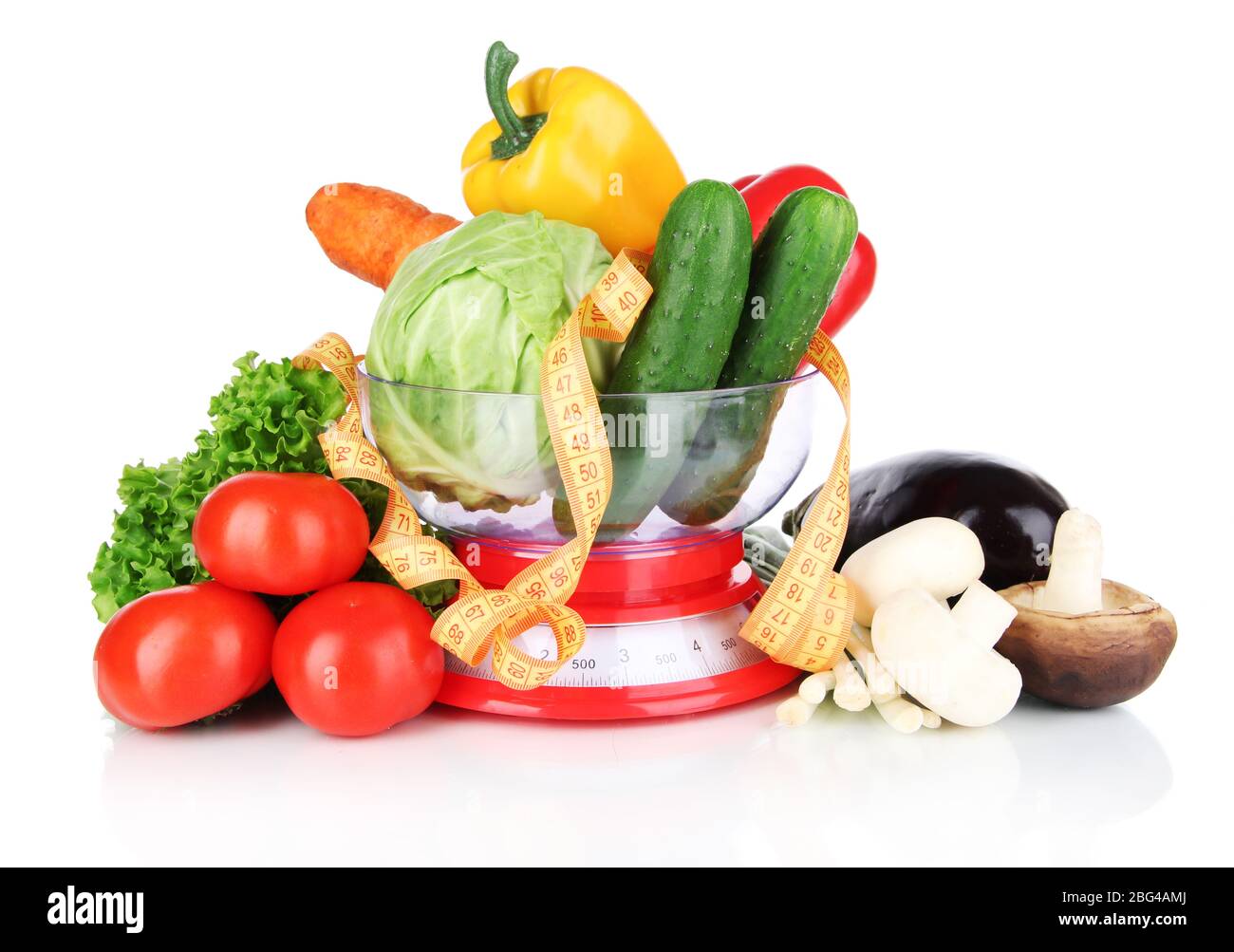 Fresh vegetables in scales isolated on white Stock Photo - Alamy